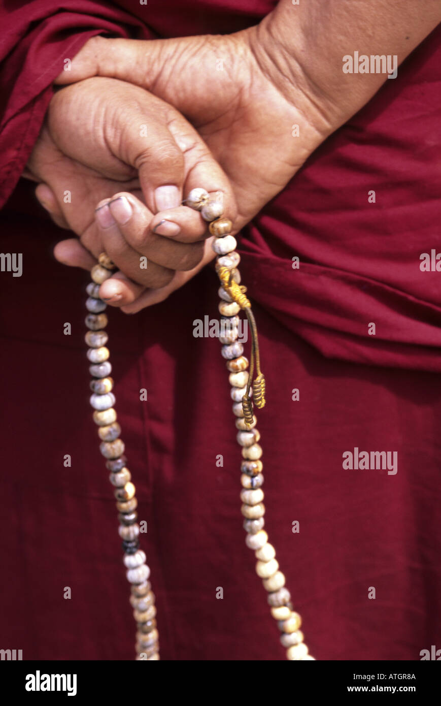Detail of monk's hands keeping the rosary, Ladakh, India Stock Photo ...