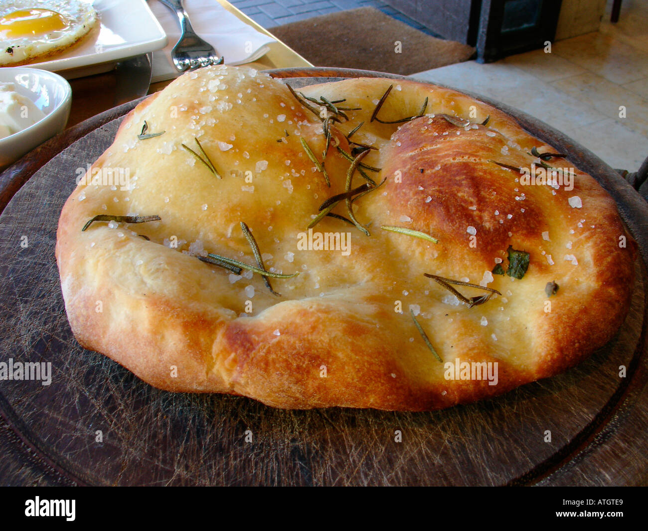 Italian Focaccia bread with rosemarin herb and large grains of salt ...