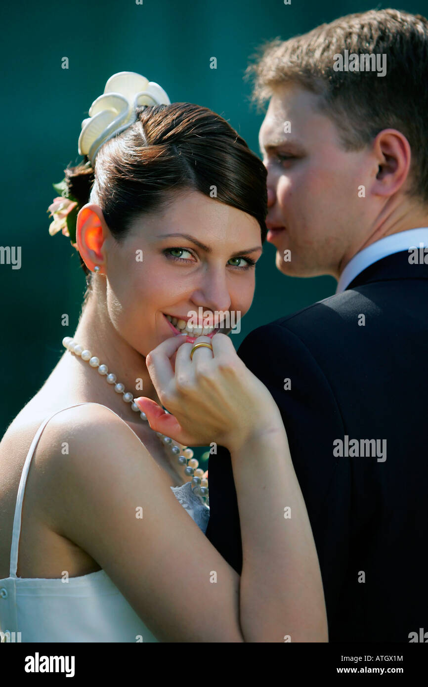 Beautiful smiling bride in white wedding dress with new husband Stock ...