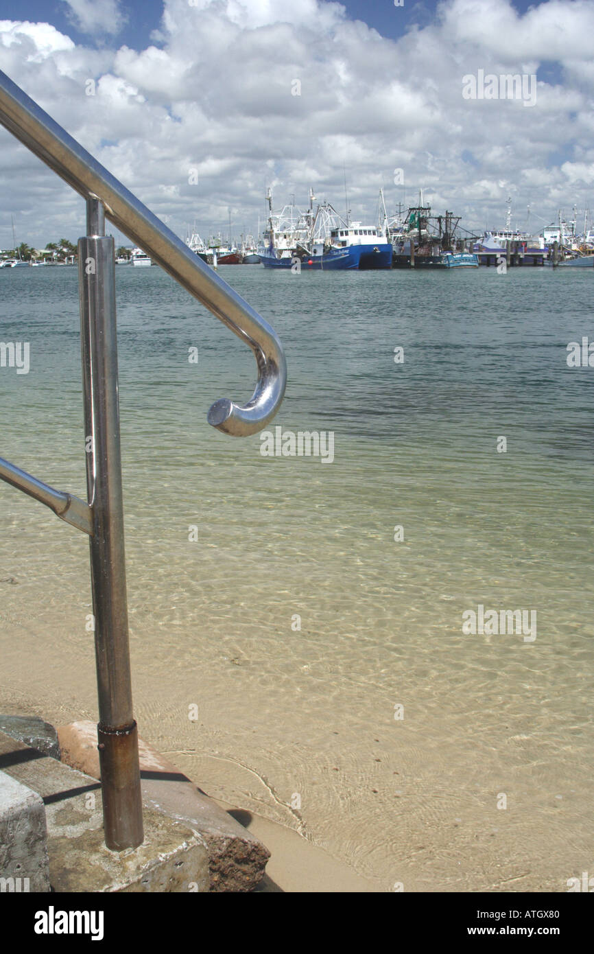 STAINLESS STEEL AND CONCRETE /STEPS STAIRS LEADING TO THE WATER ...