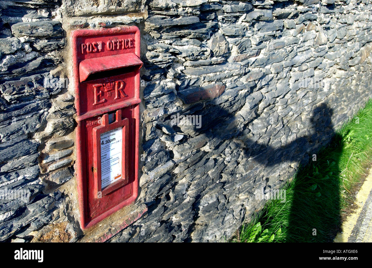 A letterbox built into a slate wall in the fishing village of Port ...
