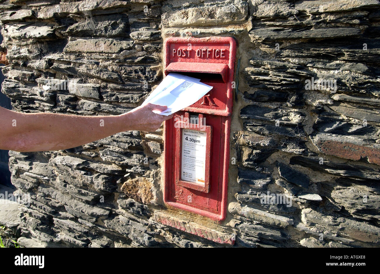 A letterbox built into a slate wall in the fishing village of Port ...