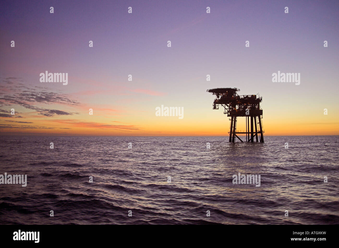 oil rig at sunset Stock Photo - Alamy