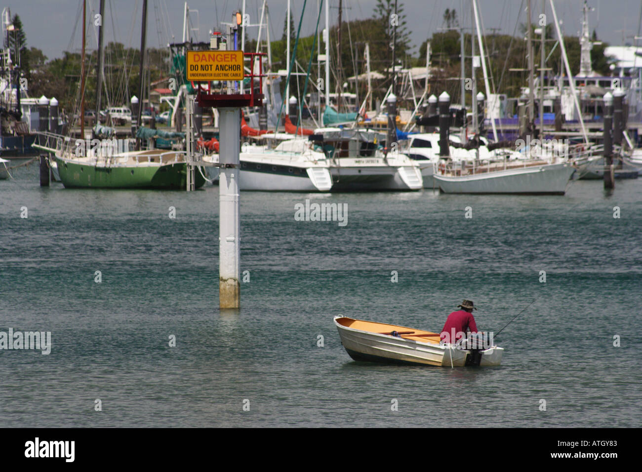 MAN FISHING IN A DINGHY MOOLOOLABA SUNSHINE COAST QUEENSLAND AUSTRALIA ...