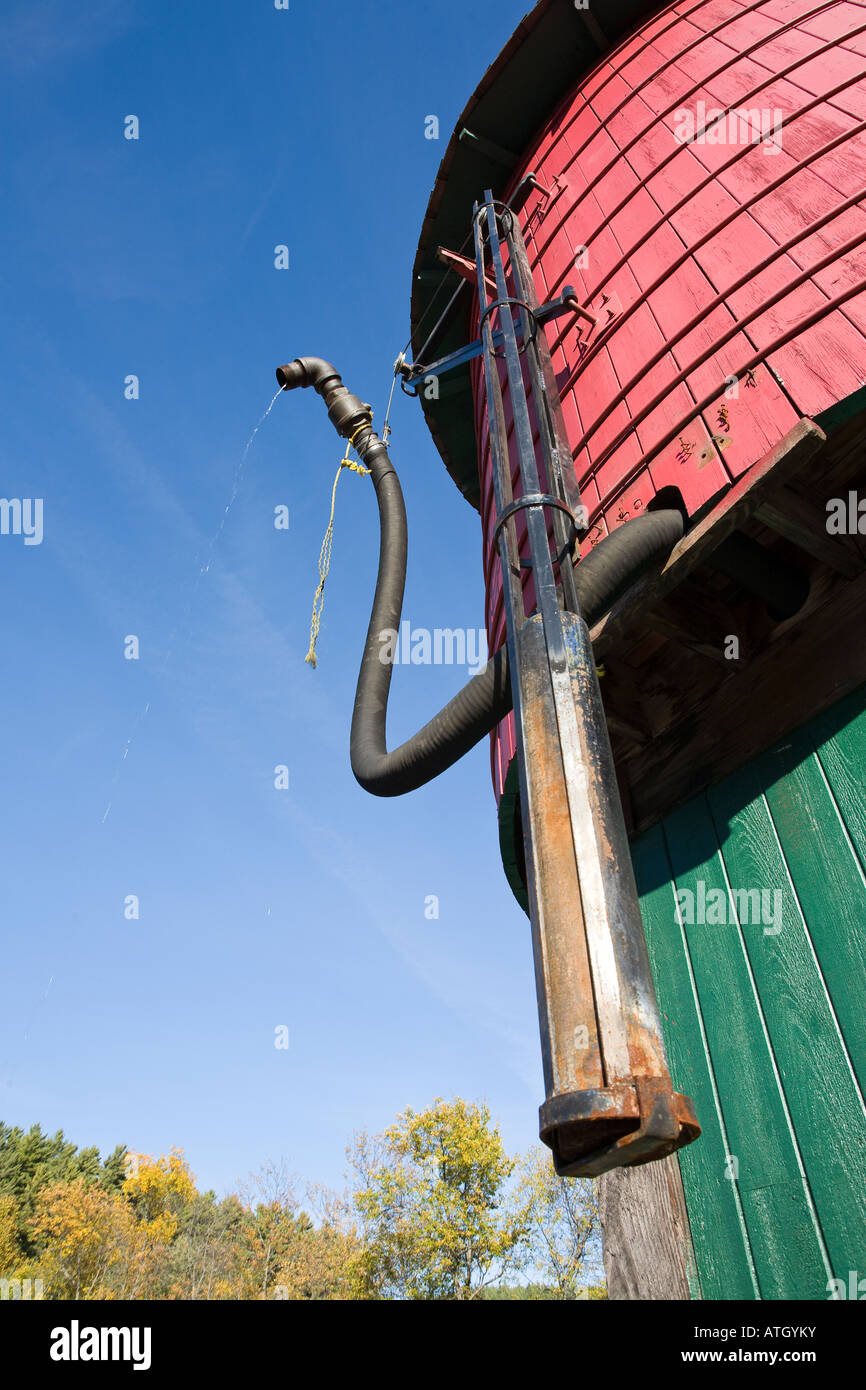 Steam Train Water Tower. A red and green wooden watertower still ...