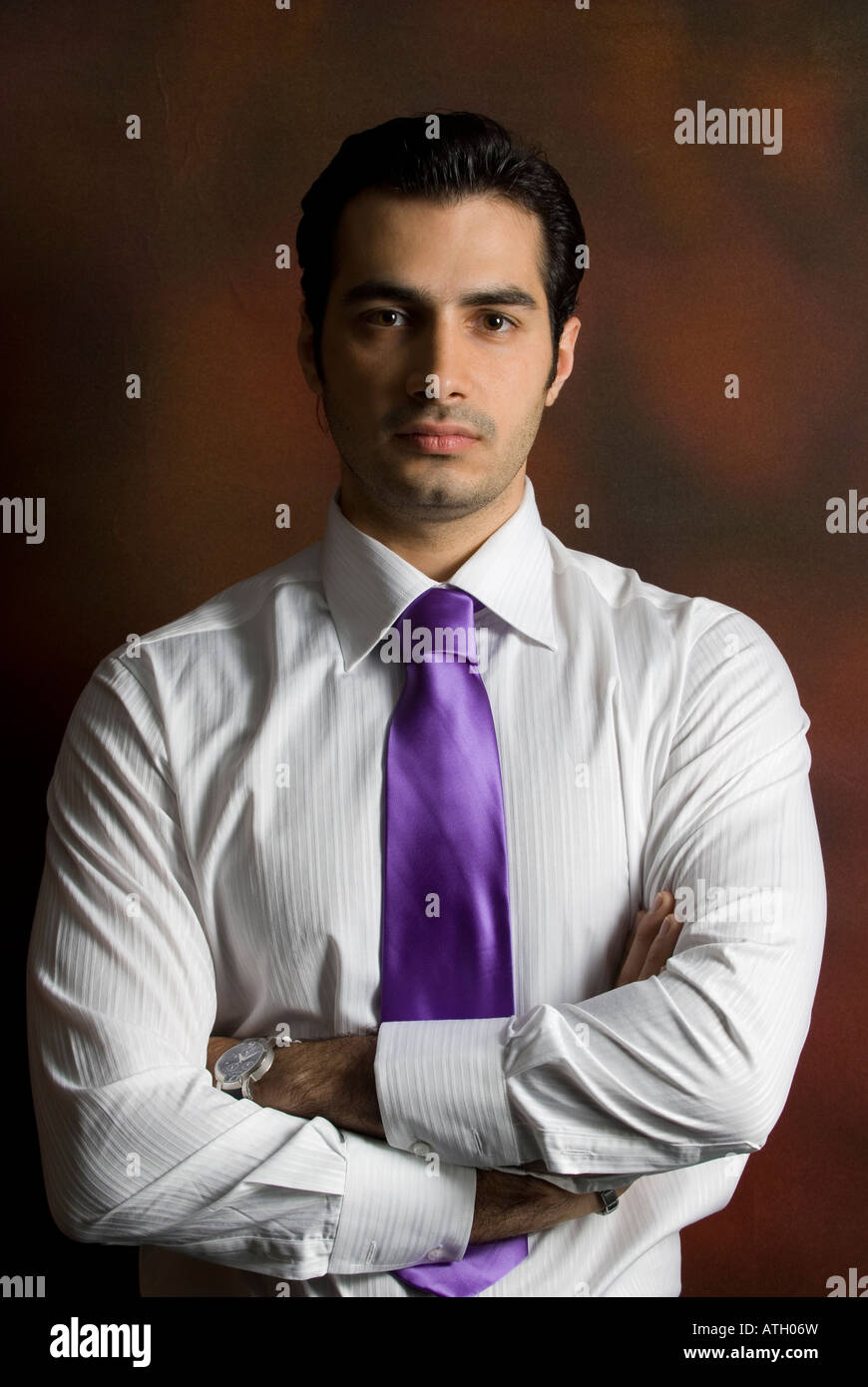 Confident business man arms folded Stock Photo - Alamy