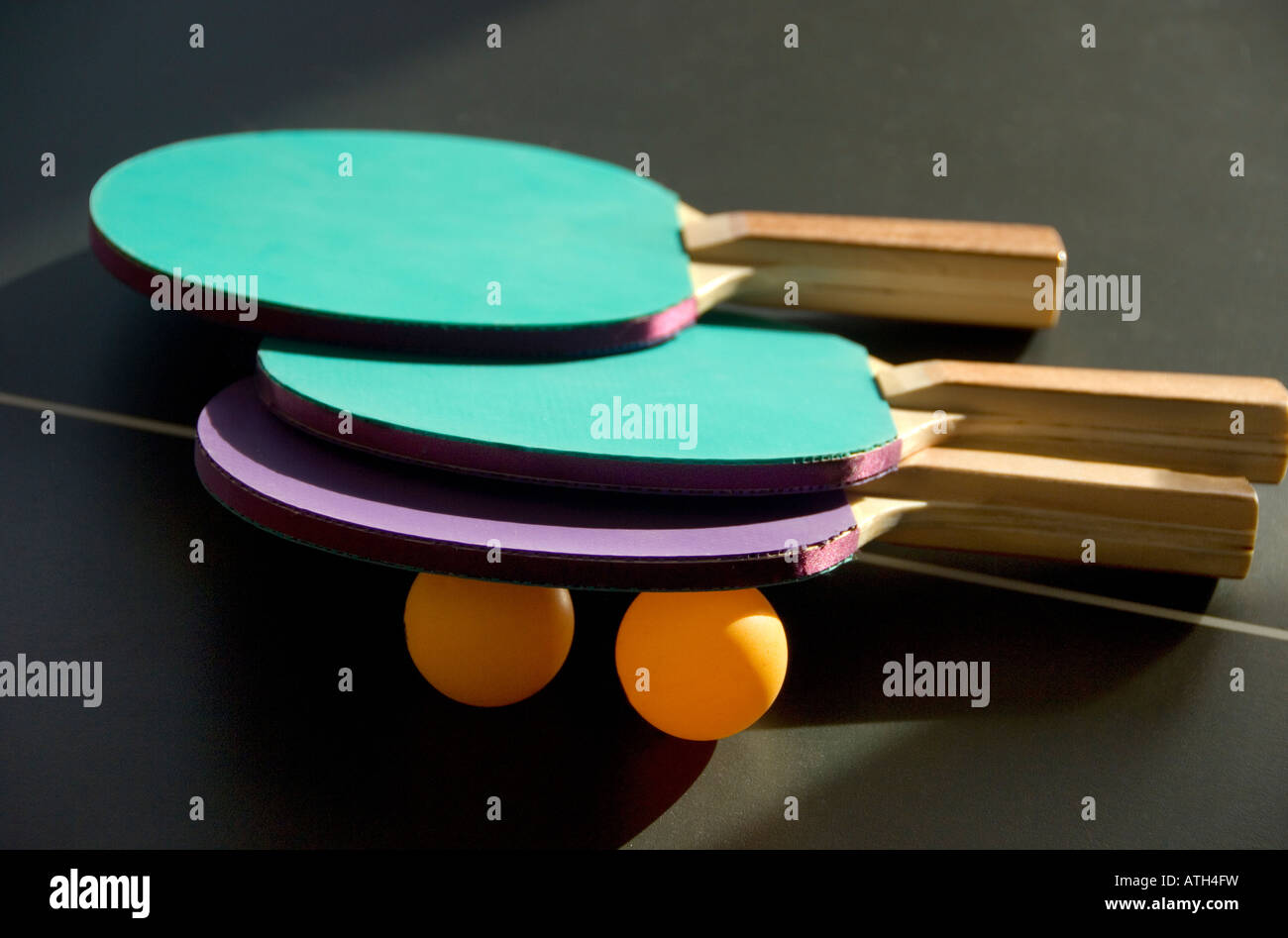 Ping Pong paddles table and balls Stock Photo - Alamy