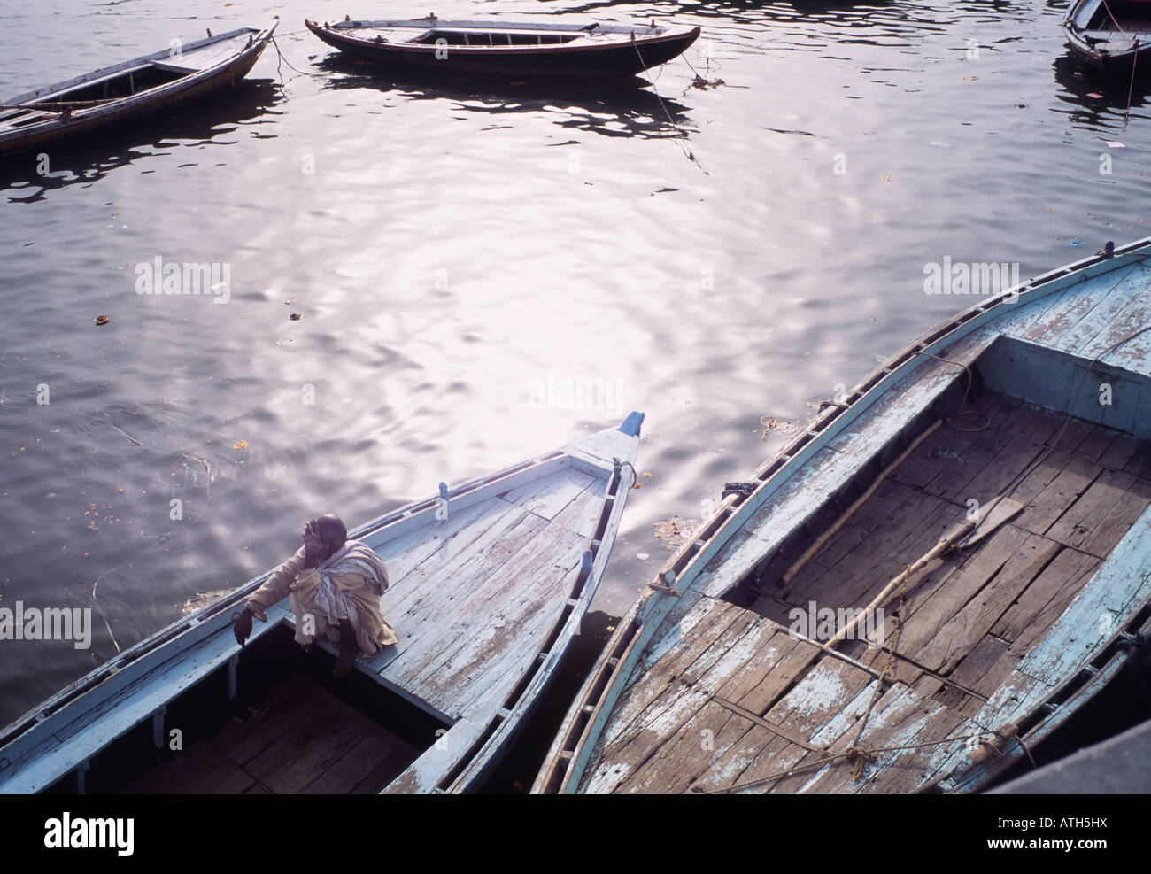 Indian man on boat, Ganges river, Varanasi Stock Photo - Alamy
