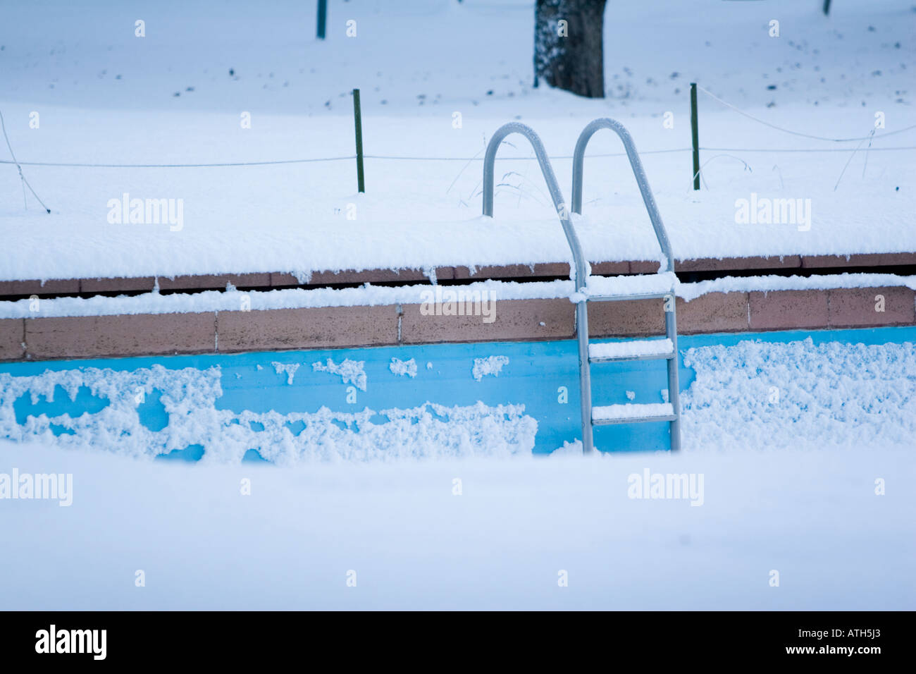 Swimming pool covered in snow Stock Photo - Alamy