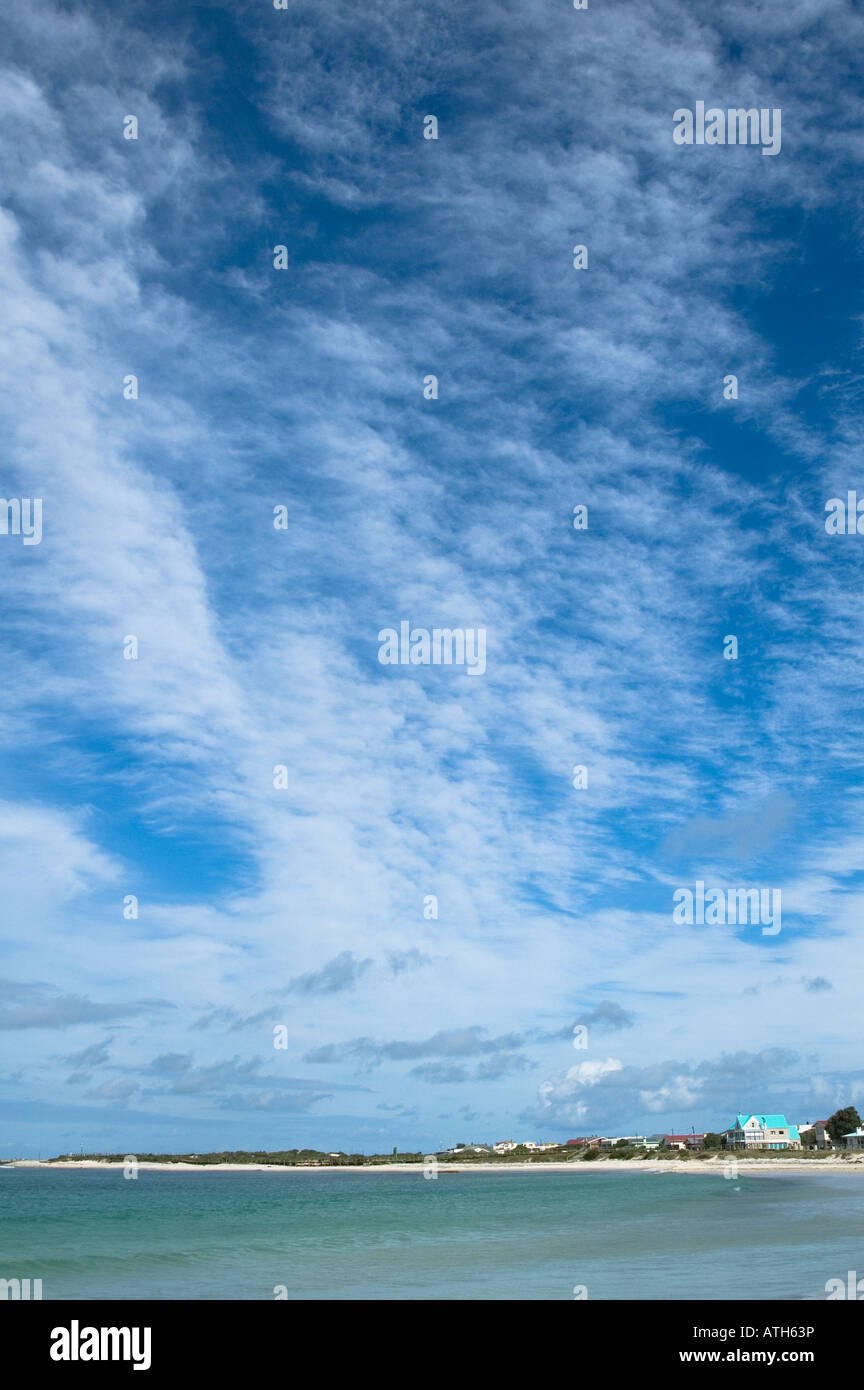 Island styled with tropical clouds and green seas Stock Photo - Alamy