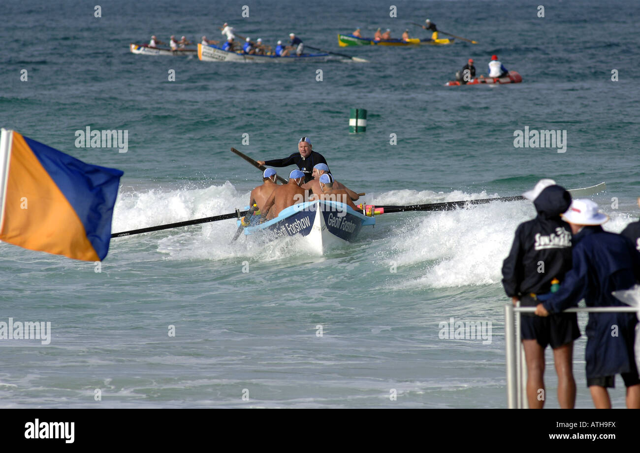 Judges watch a boat race in the National Surf Lifesaving Championships ...