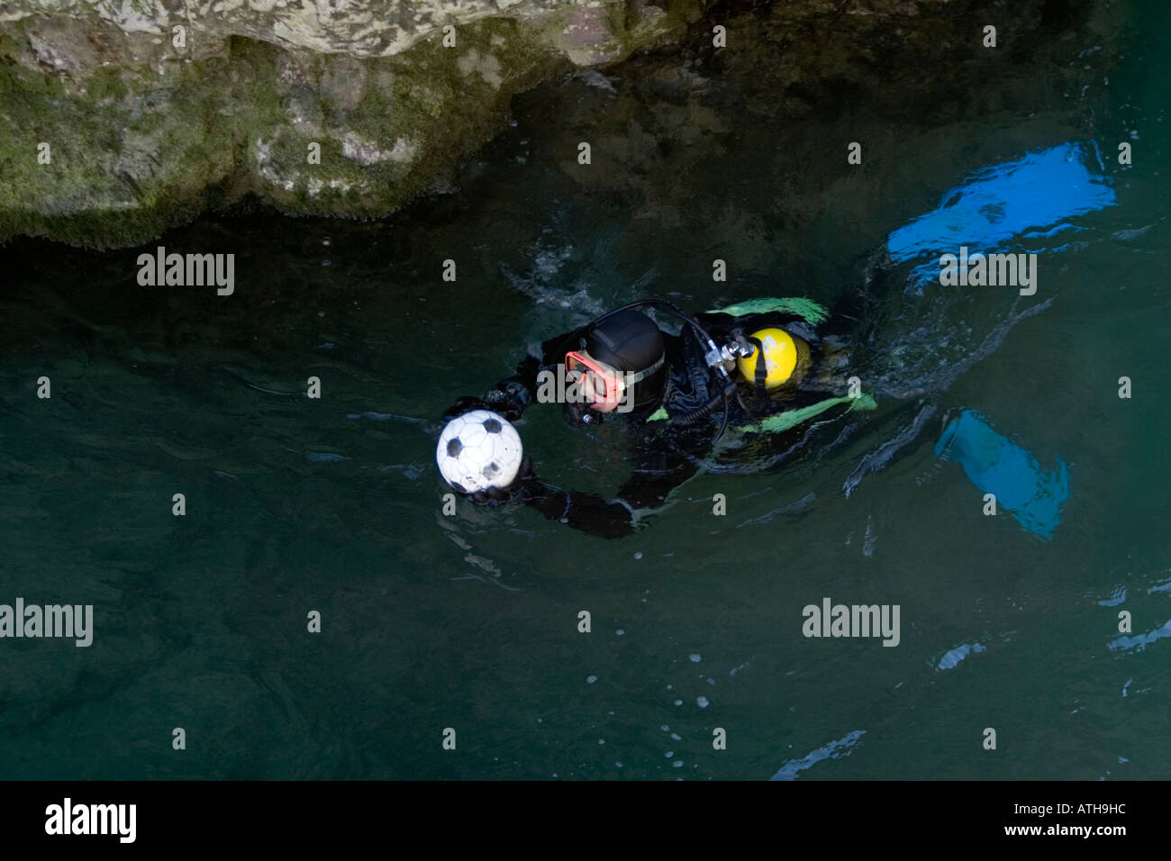 Scuba diver with football Stock Photo - Alamy
