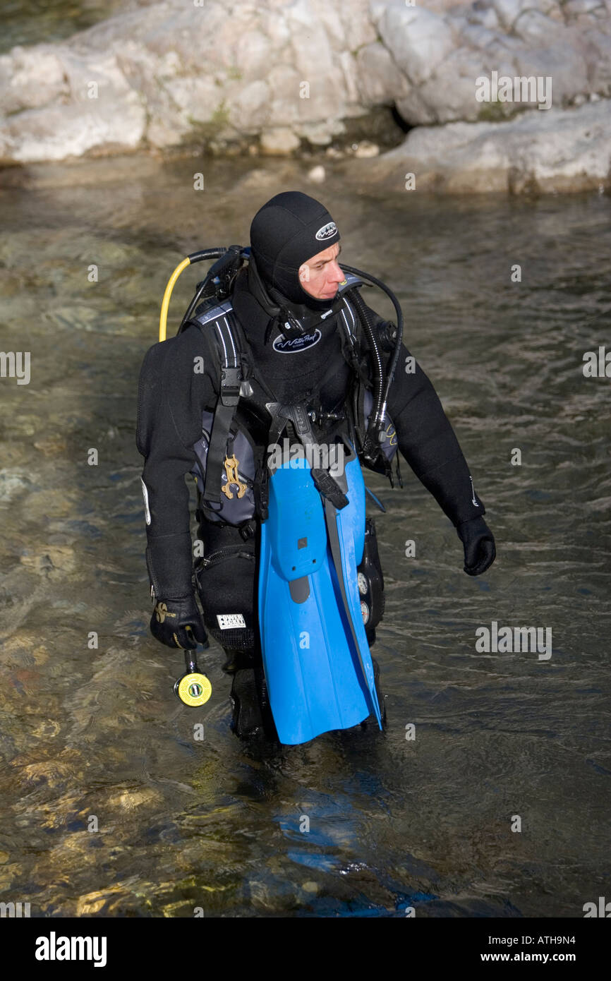 Scuba diver in river, mid-winter Italy Stock Photo - Alamy