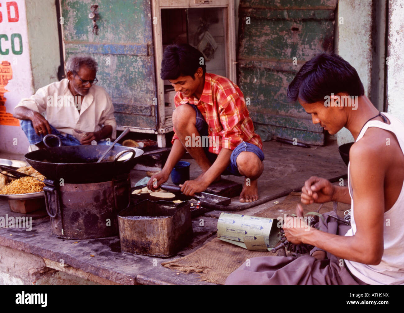 men cooking outside house, India Stock Photo - Alamy
