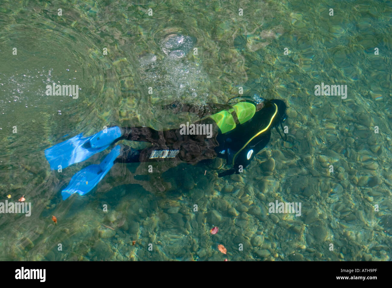 Sub aqua diver in shallow mountain river Stock Photo - Alamy