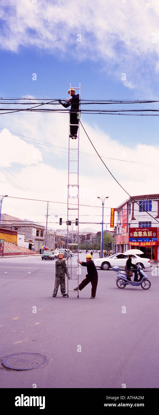 Worker up ladder in road hi-res stock photography and images - Alamy