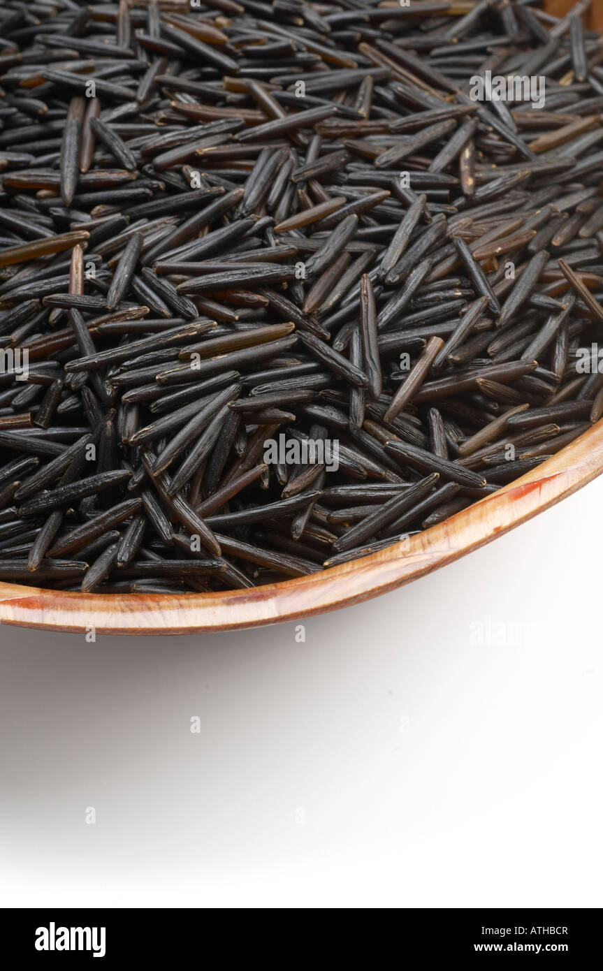 Wild Rice in bowl on white background Stock Photo - Alamy