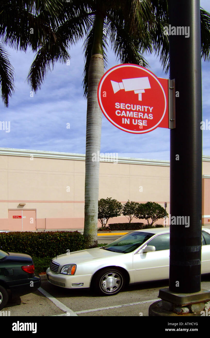 Security camera in use sign to protect shoppers at mall Stock Photo - Alamy