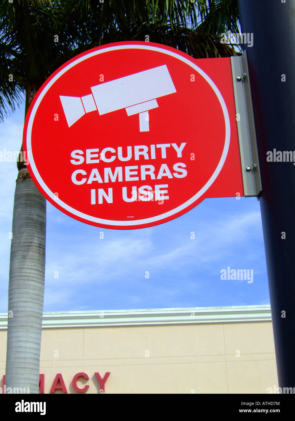 Security camera in use sign to protect shoppers at mall Stock Photo - Alamy