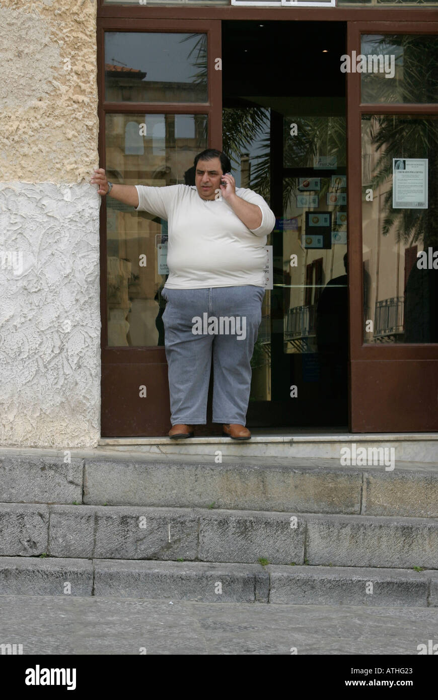 Men talking outside doorway hi-res stock photography and images - Alamy
