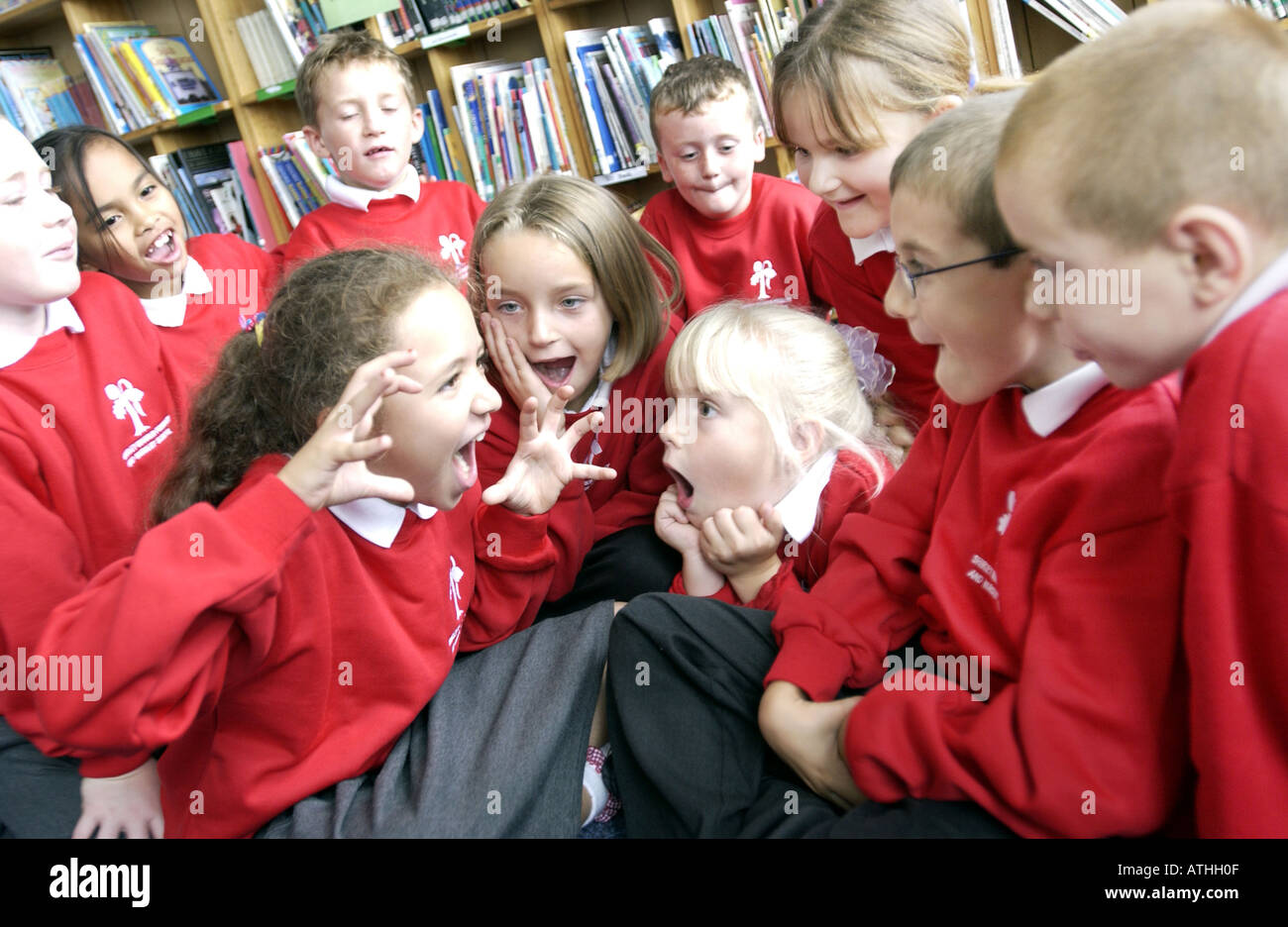 Bright alert boys and girls in a primary school storytelling class with ...