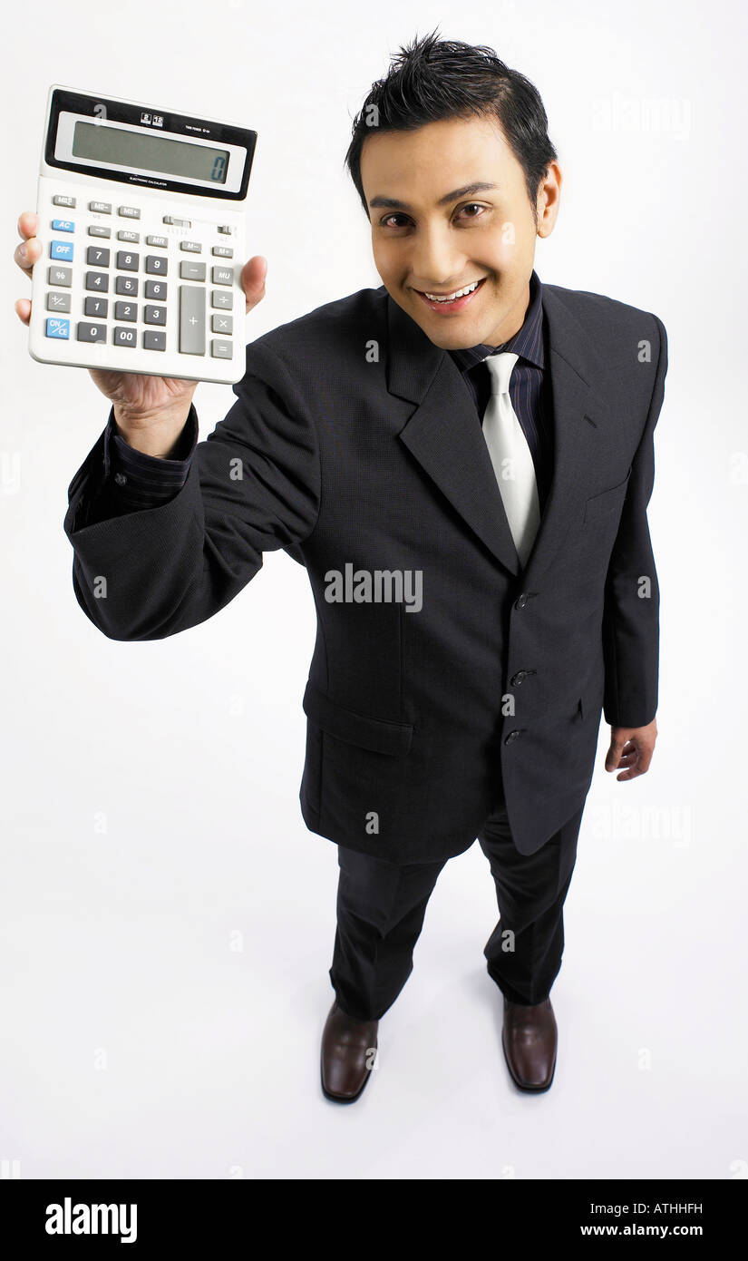 businessman holding a calculator Stock Photo - Alamy