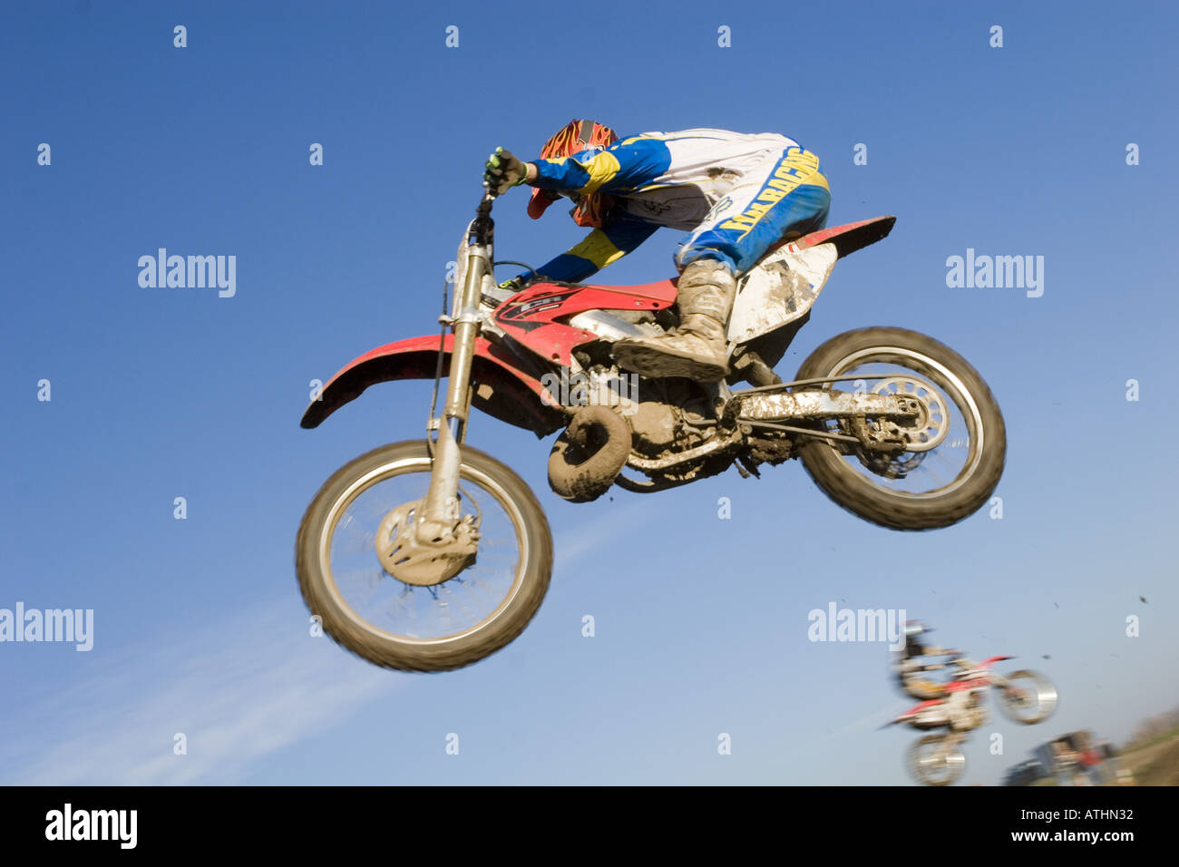 Motocross riders making jumps Stock Photo - Alamy