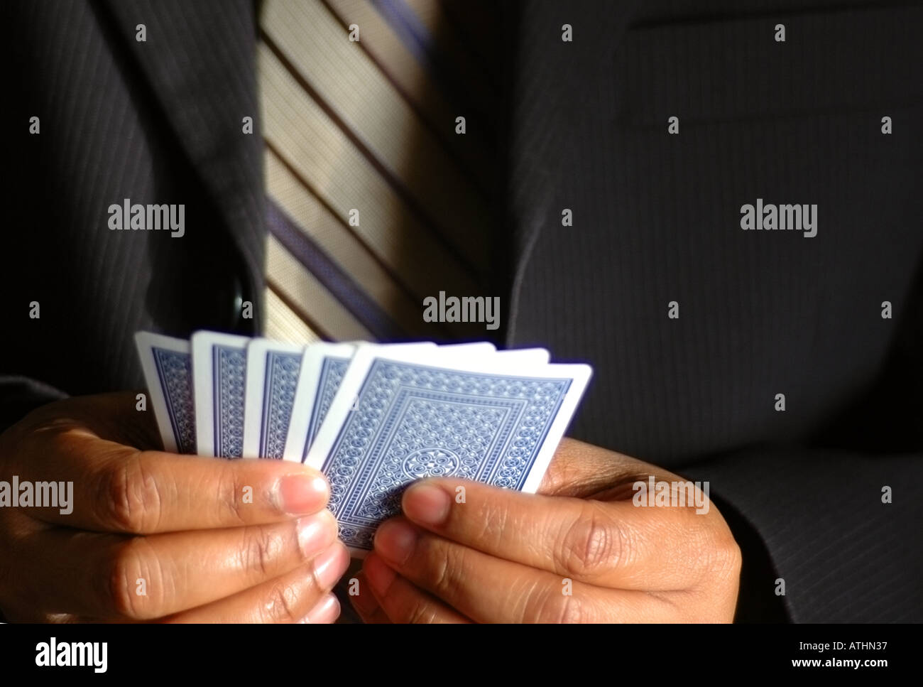 Man In Suit With Playing Cards Stock Photo - Alamy