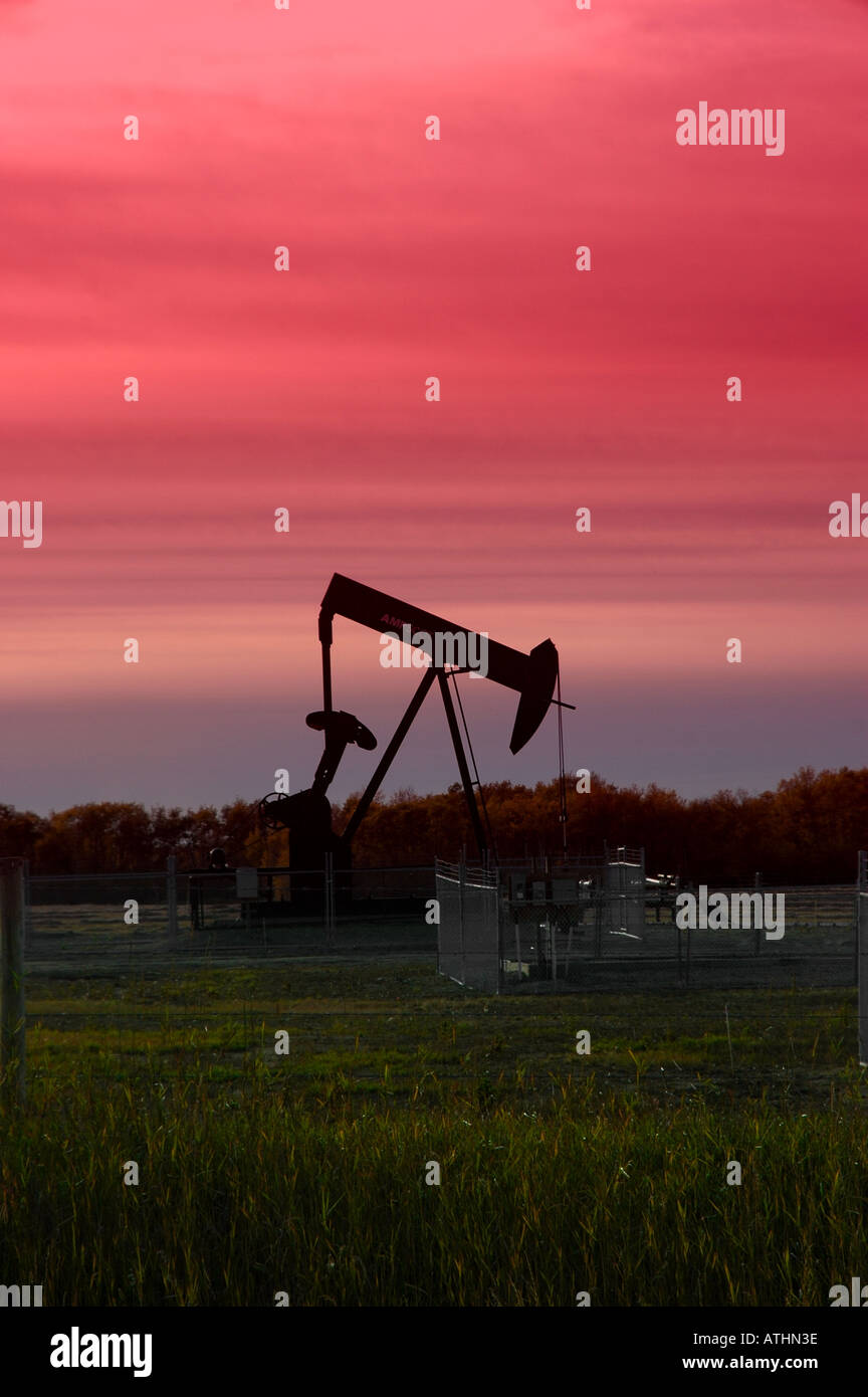 Oil Pump With Red Sunset Sky Stock Photo - Alamy