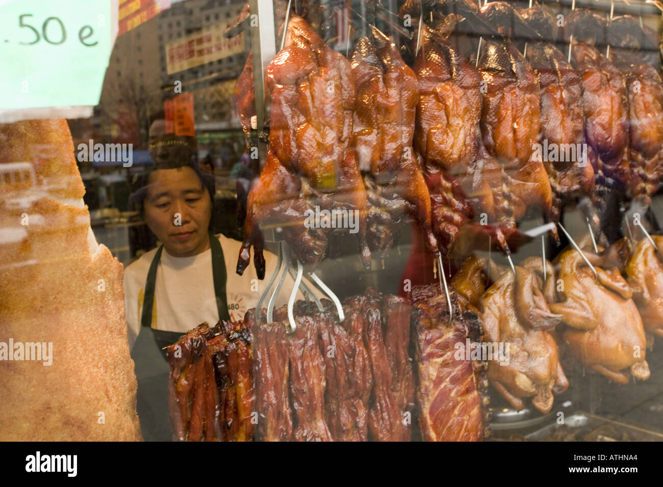 Roast Peking duck and ribs hanging in restaurant window Chinatown NYC ...