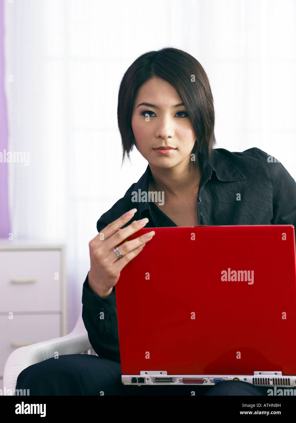 businesswoman with laptop posing to camera Stock Photo - Alamy