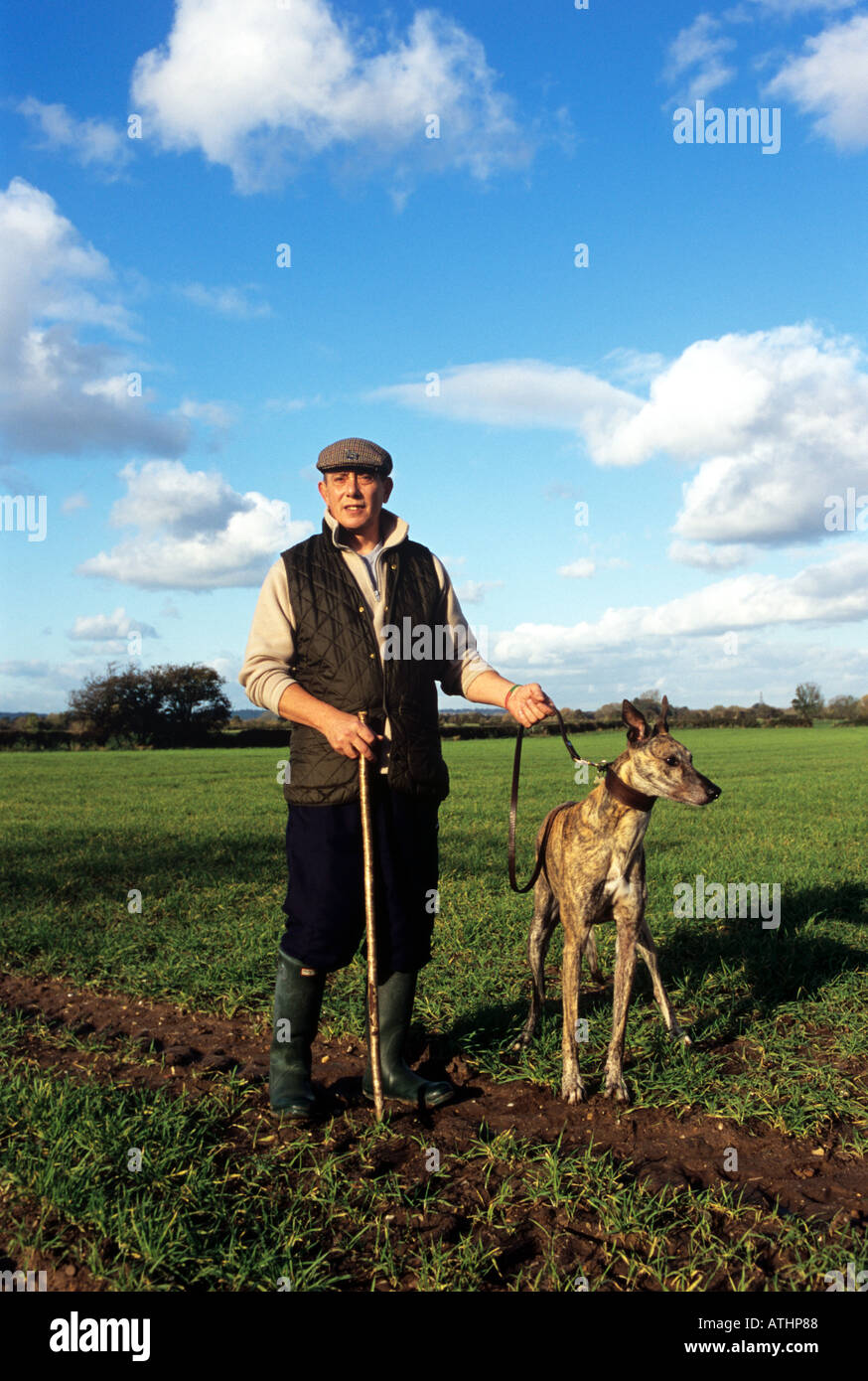 Man and Dog out walking countryside england Stock Photo - Alamy