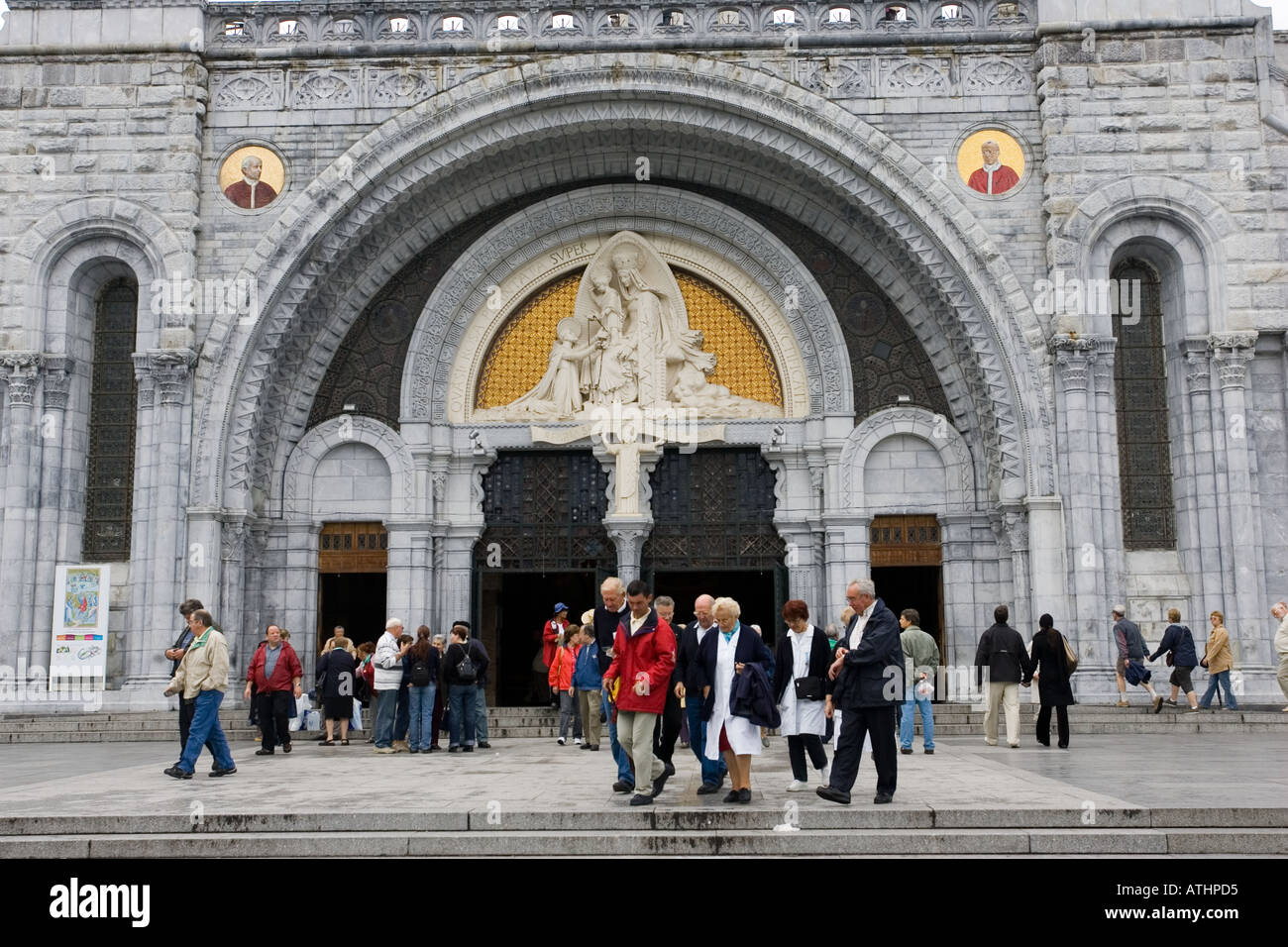 Pilgrims leaving the Basilica Lourdes France Stock Photo - Alamy