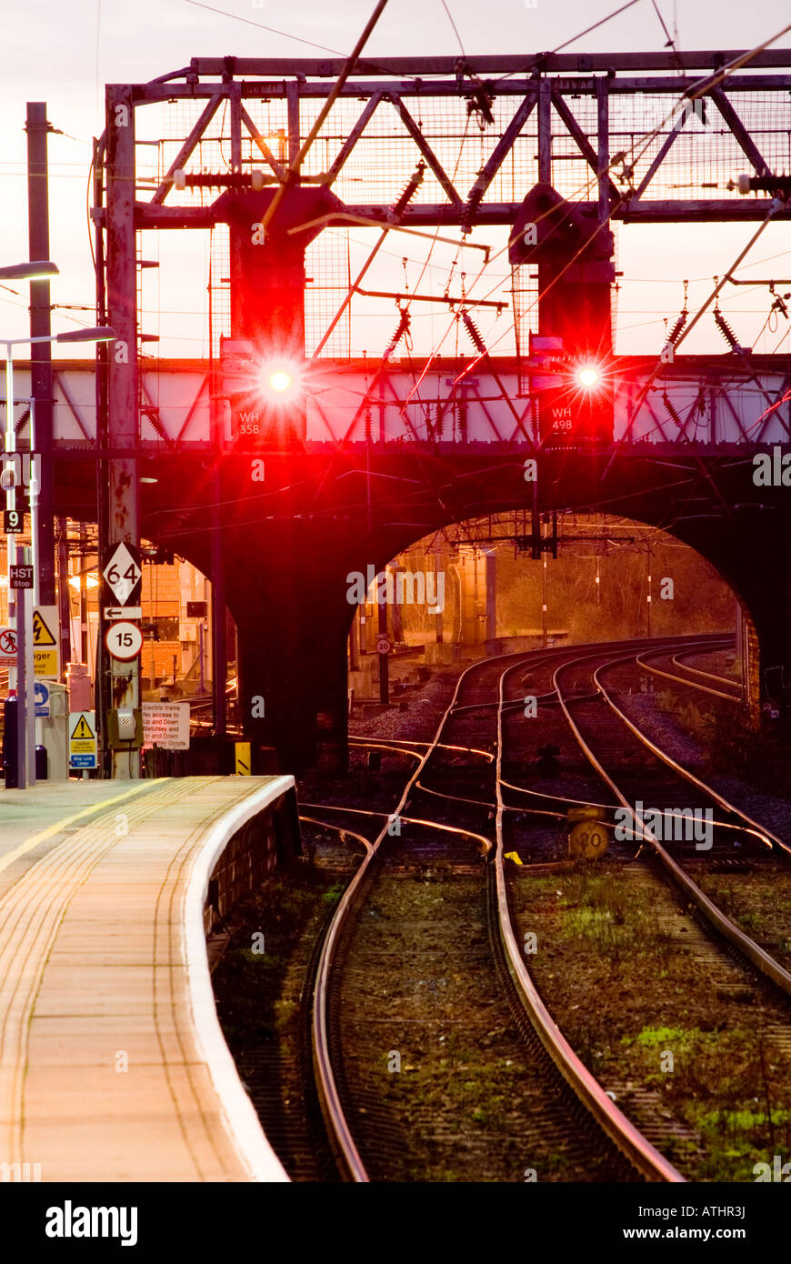 red signals at the end of a platform of a railway station in england ...