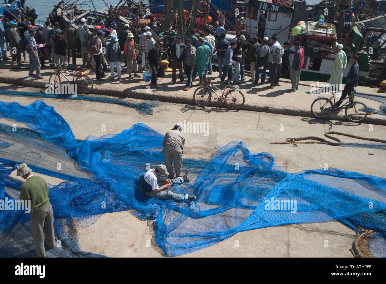 Fishermen mending nets hi-res stock photography and images - Alamy