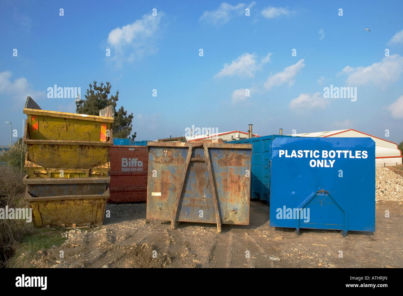 empty skips on wasteground Stock Photo - Alamy