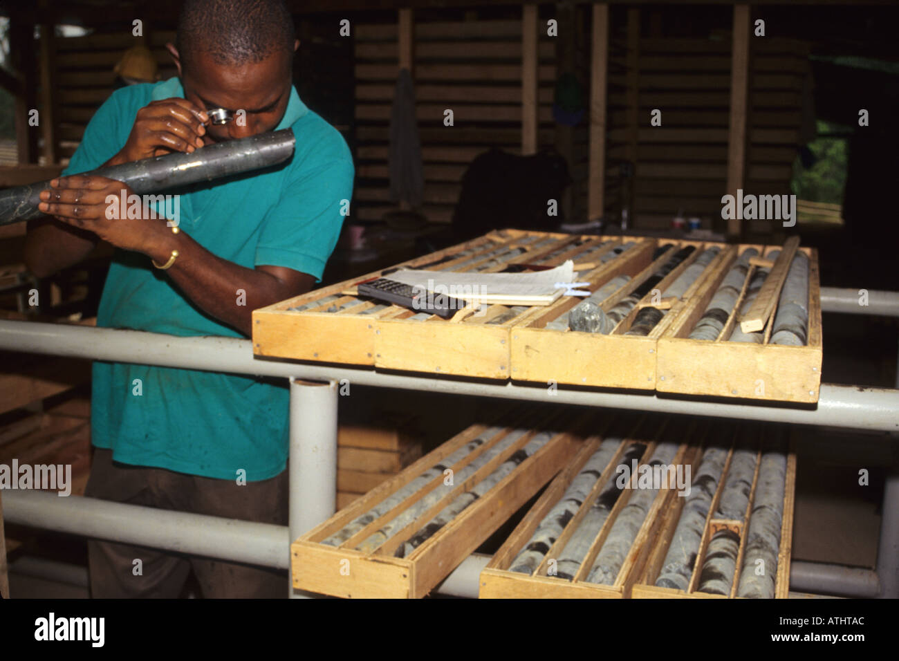 Geologist Examining Sample Mineral Core for Gold, SOMIAF Gold Mine ...
