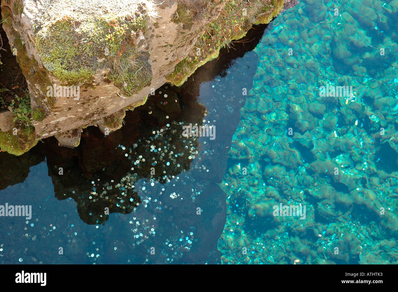 Coins thrown into the Mid Atlantic Rift in Thingvellir National Park ...