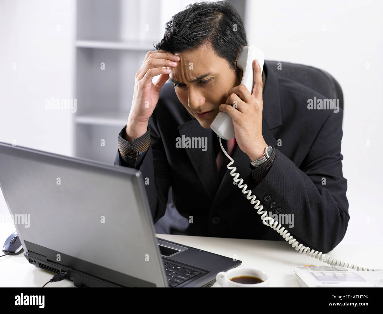 tired businessman on the phone Stock Photo - Alamy