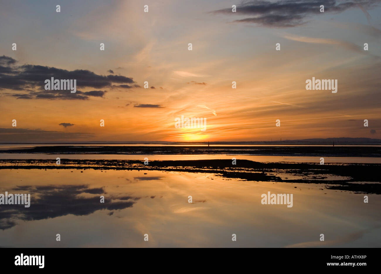 The River Severn Estuary, UK. A beautiful winter sunset over Wales ...