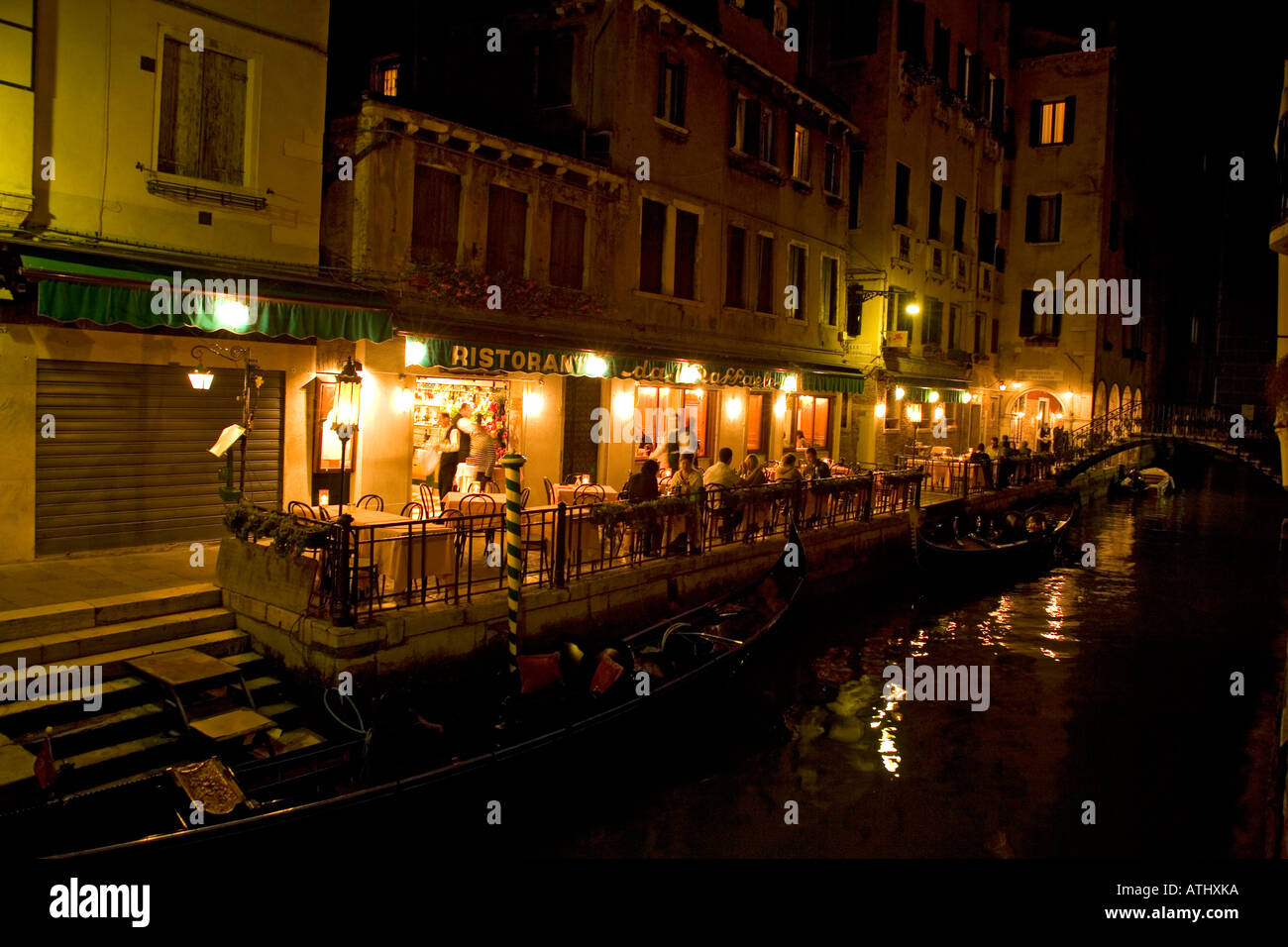 Open air restaurant at night in Venice Italy Stock Photo - Alamy