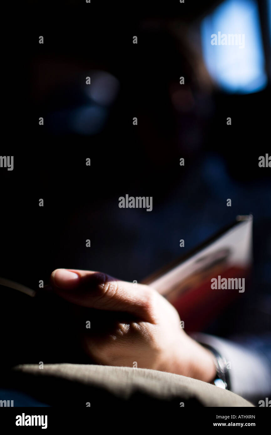 reading hand with book Stock Photo - Alamy