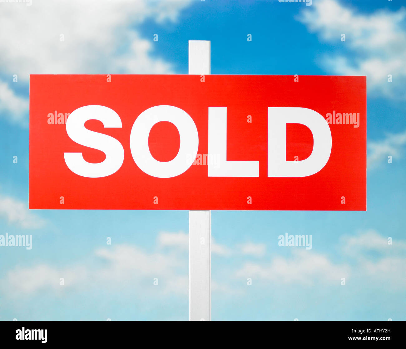 sold sign against blue sky Stock Photo - Alamy