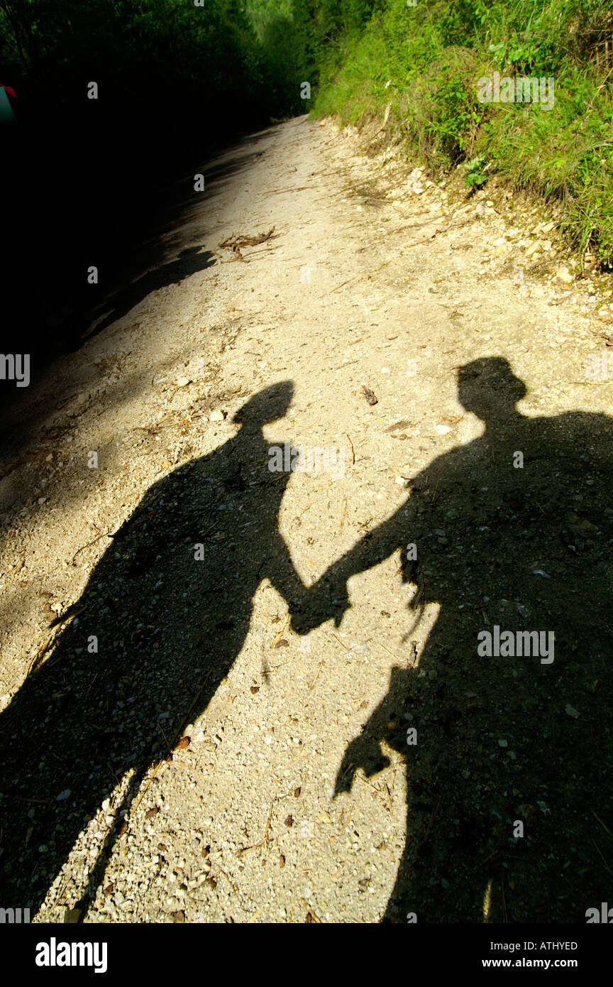 Lovers Couple shadows, touching hands, outdoors summer Stock Photo - Alamy