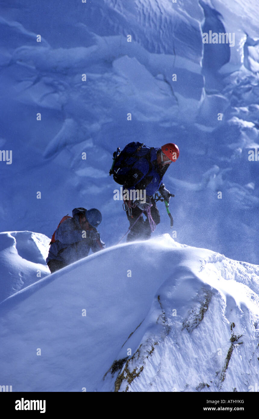 Russell Brice - mountain guide - with client on windy mountain ridge ...