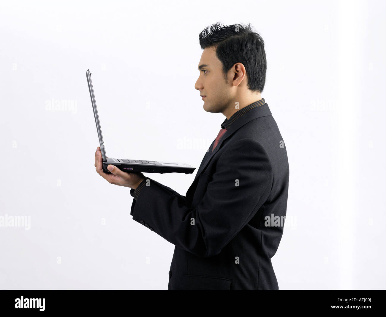 businessman holding laptop Stock Photo - Alamy