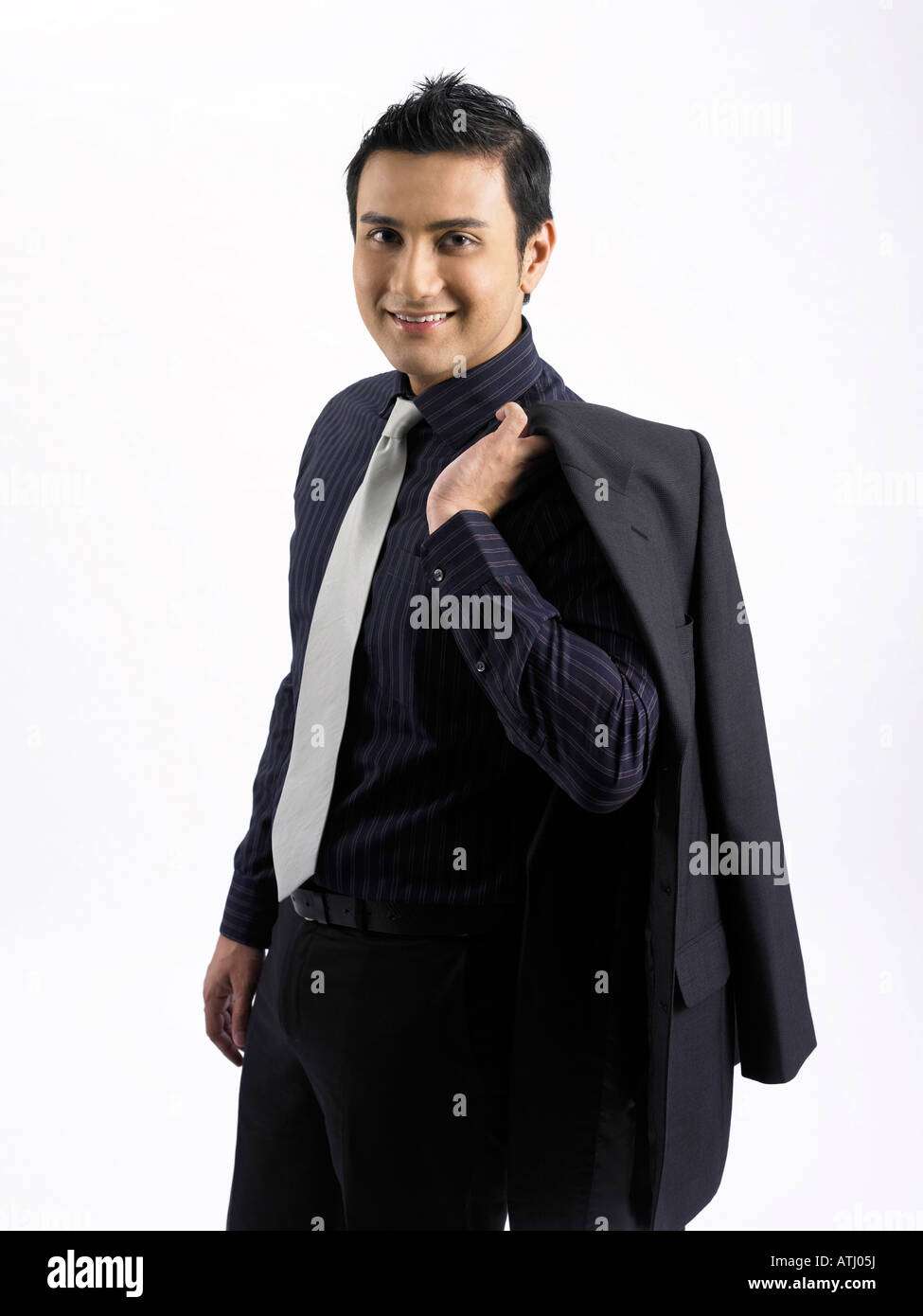 businessman holding suit jacket over his shoulder Stock Photo - Alamy