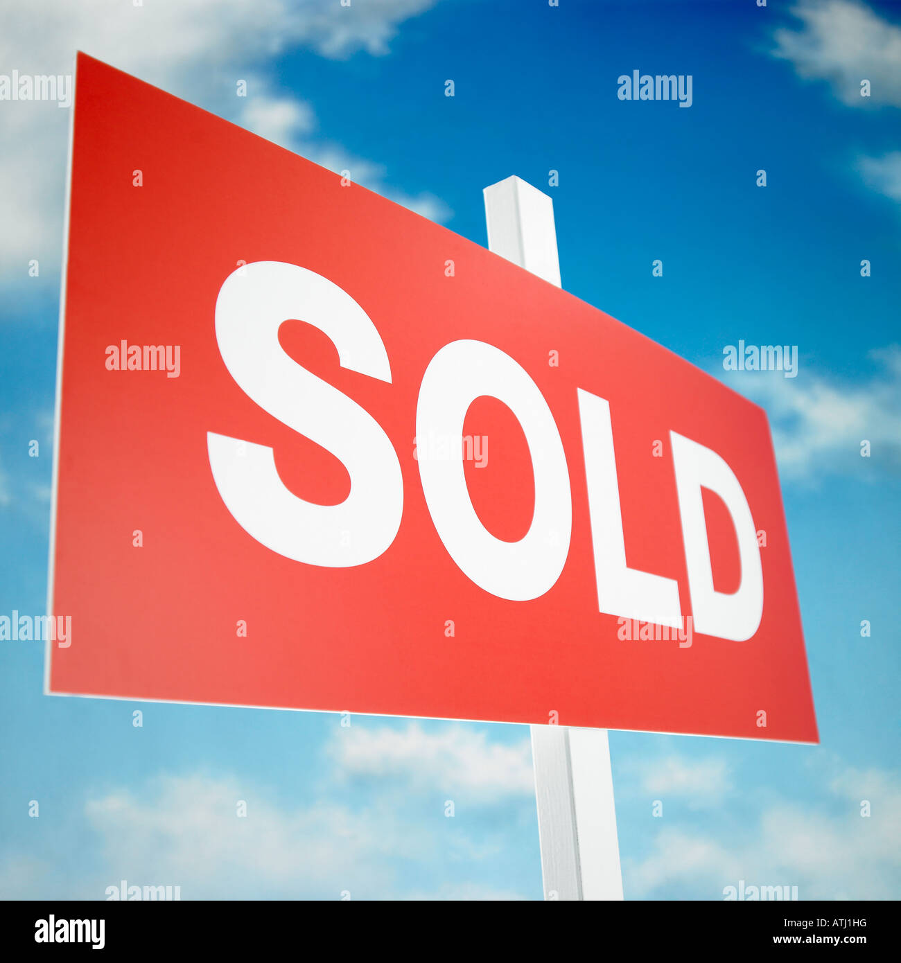 sold sign against blue sky Stock Photo - Alamy