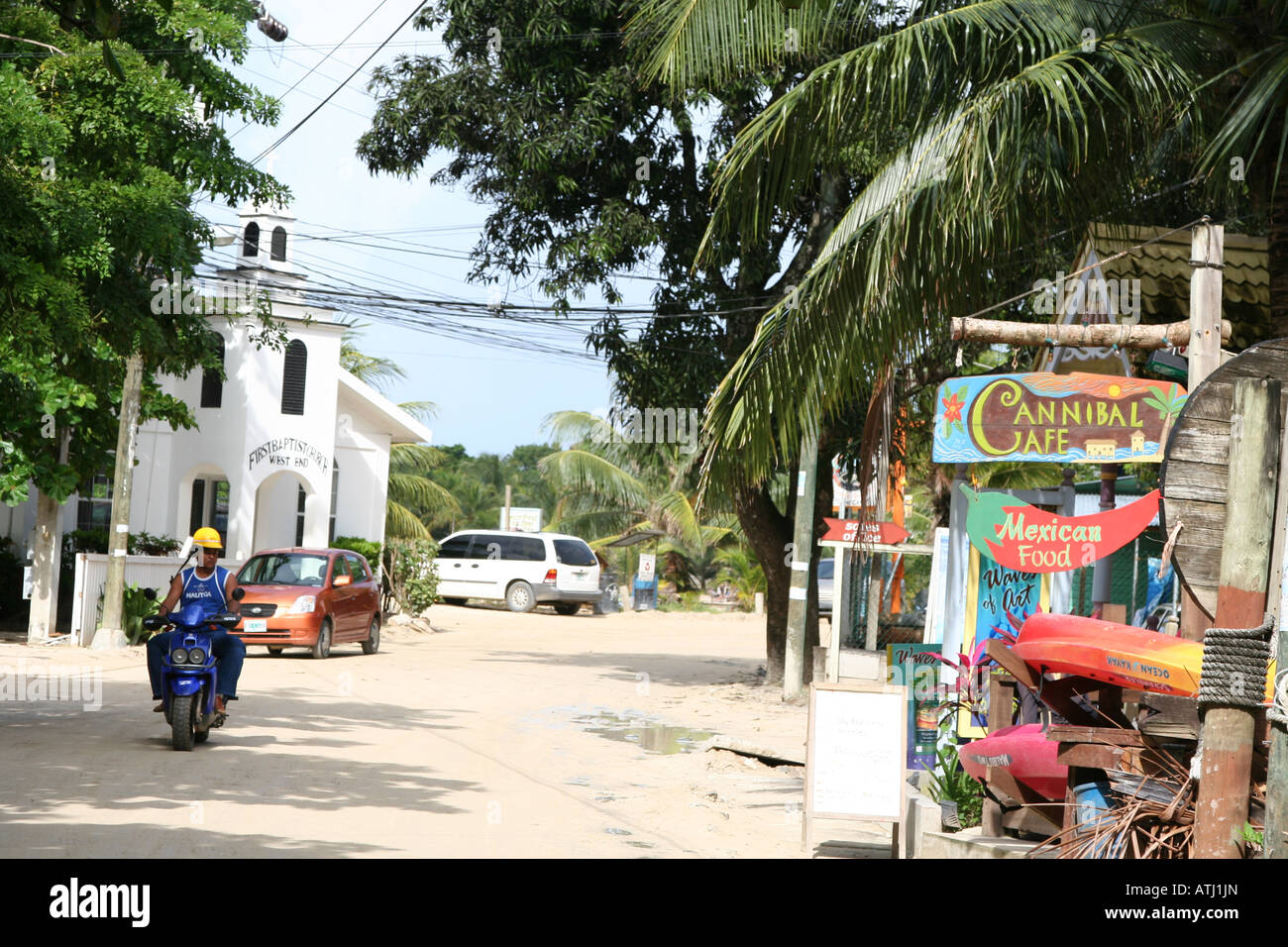 The sandy streets of the town of West Bay, on the Bay Island of Roatan ...