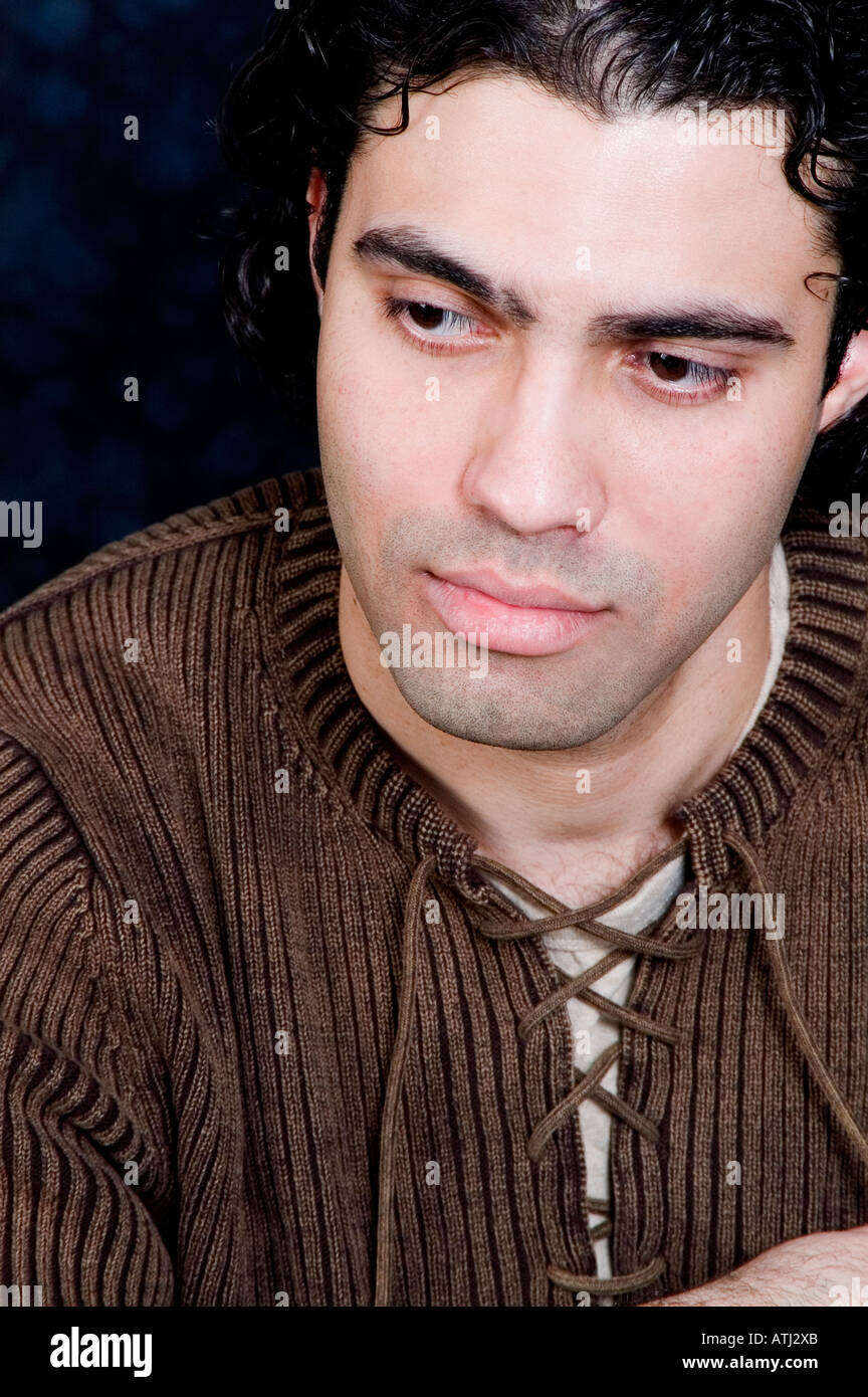 Close up of serious Arabic man looking away Stock Photo - Alamy